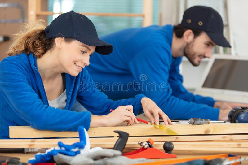 Carpenter Team Woman and Man Working Together Stock Image - Image of ...