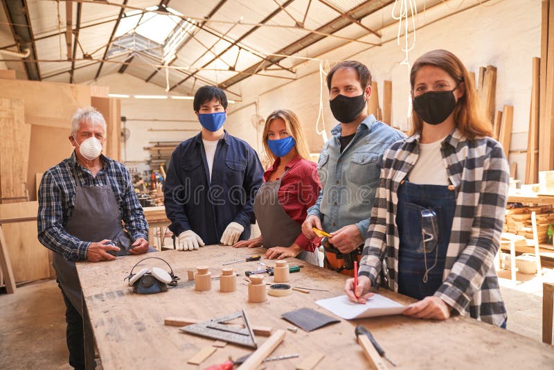 Carpenter Team in Workshop with Face Mask Stock Photo - Image of lesson ...
