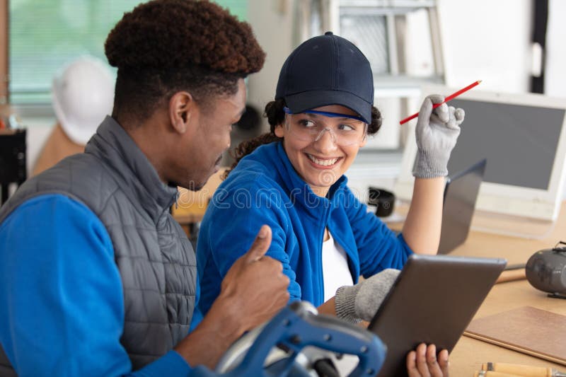 Carpenter Training Female Apprentice To Use Plane Stock Photo - Image ...