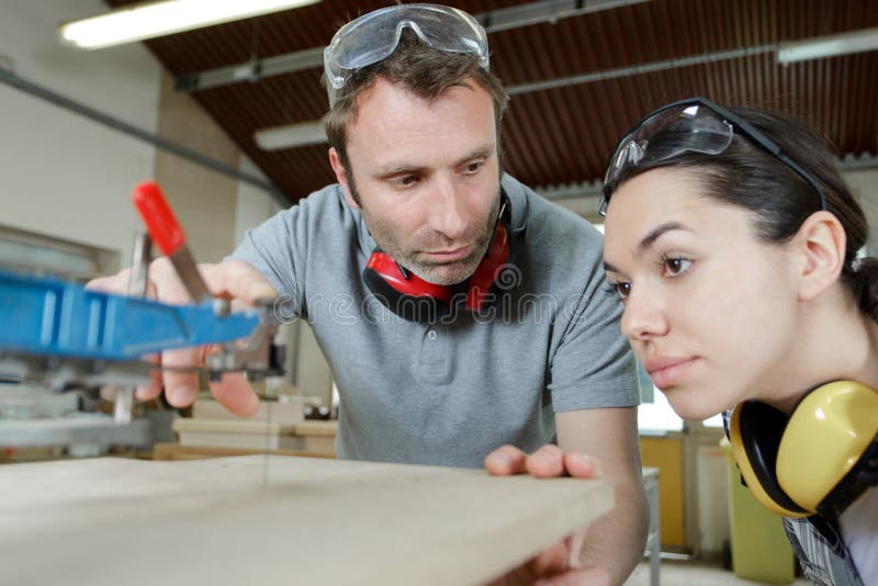 Carpenter Training Female Apprentice in Workshop Stock Image - Image of ...