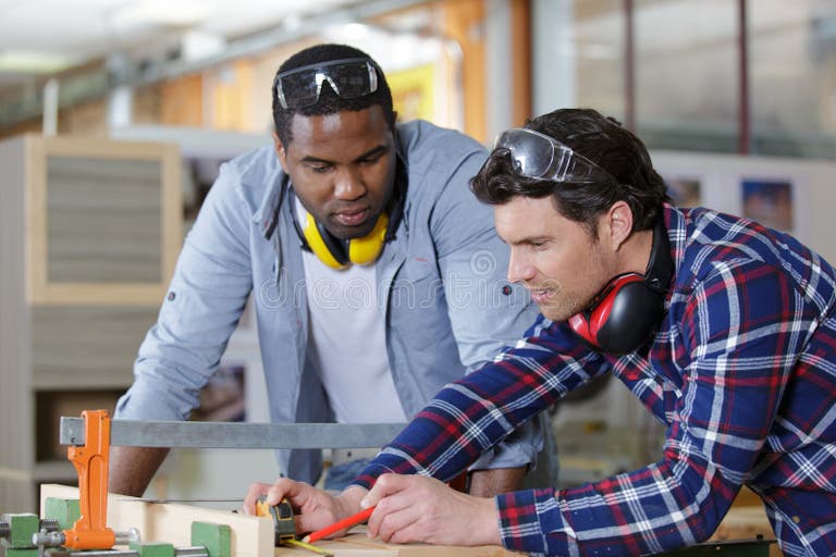 Carpenter Training Male Apprentice To Use Plane Stock Photo - Image of ...