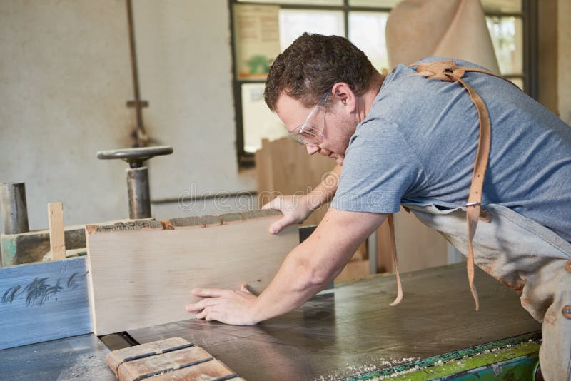Carpenter in Training on the Planing Machine Stock Photo - Image of ...
