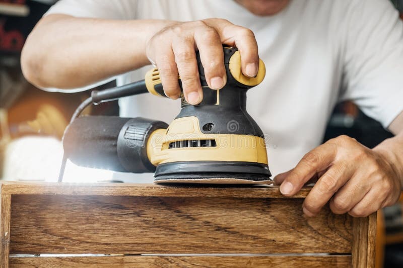 Carpenter Use Random Orbit Sander or Palm Sander Polishes Wooden in the ...