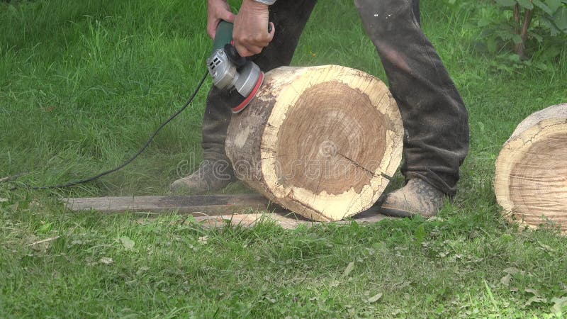 Carpenter Uses Handheld Power Sander To Smooth Sand Oak Tree Bark ...