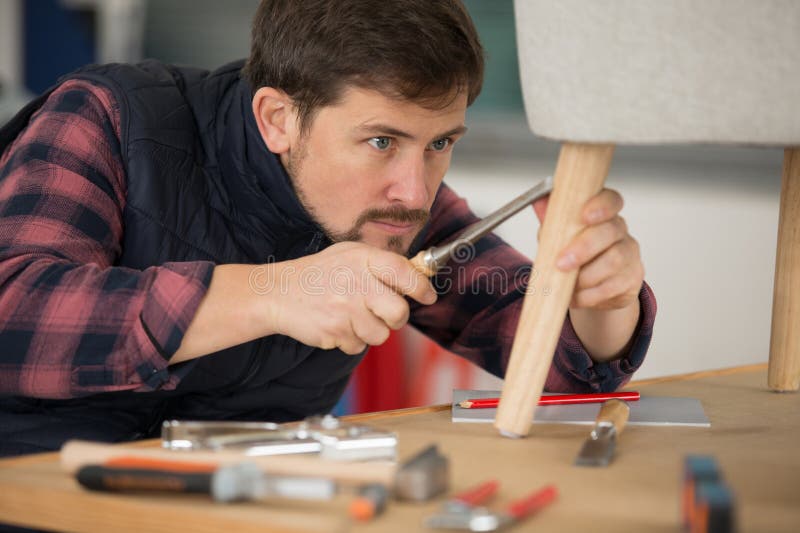 Carpenter Using Chisel on Wooden Chair Leg Stock Image - Image of ...