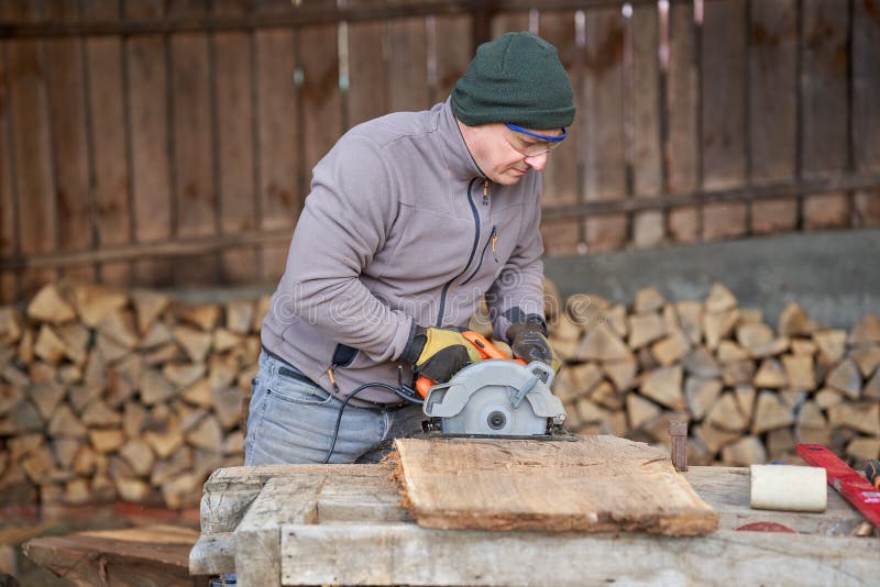 Carpenter Using Circular Saw Stock Image - Image of laser, person ...