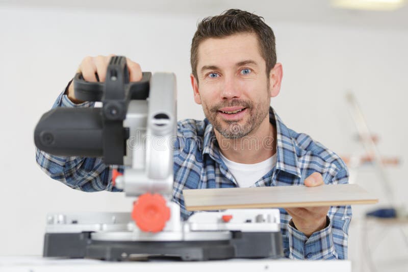 Carpenter Using Circular Saw in Workshop Stock Photo - Image of ...