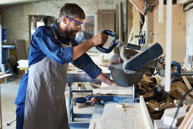 Carpenter Using Electric Cutting Unit Stock Image - Image of machine ...