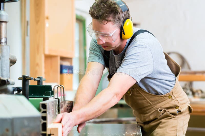 Carpenter Using Electric Saw in Carpentry Stock Photo - Image of ...