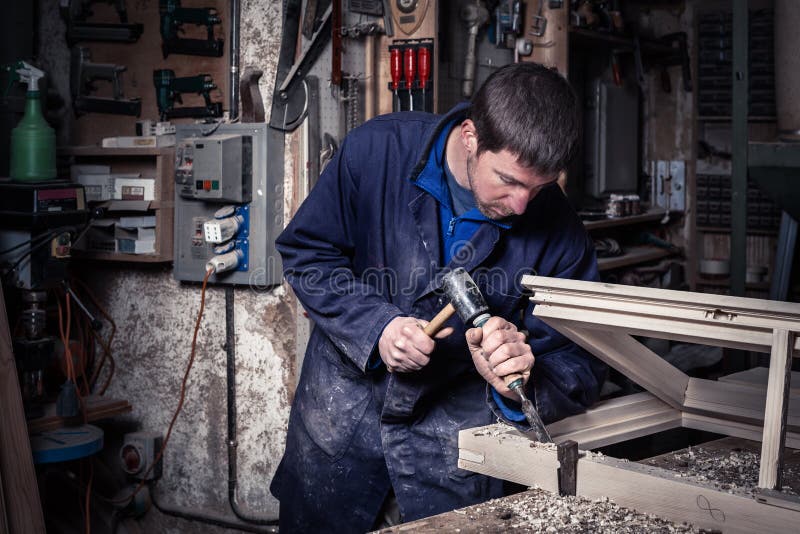 Carpenter Using Hammer and Chisel in Workshop Stock Image - Image of ...