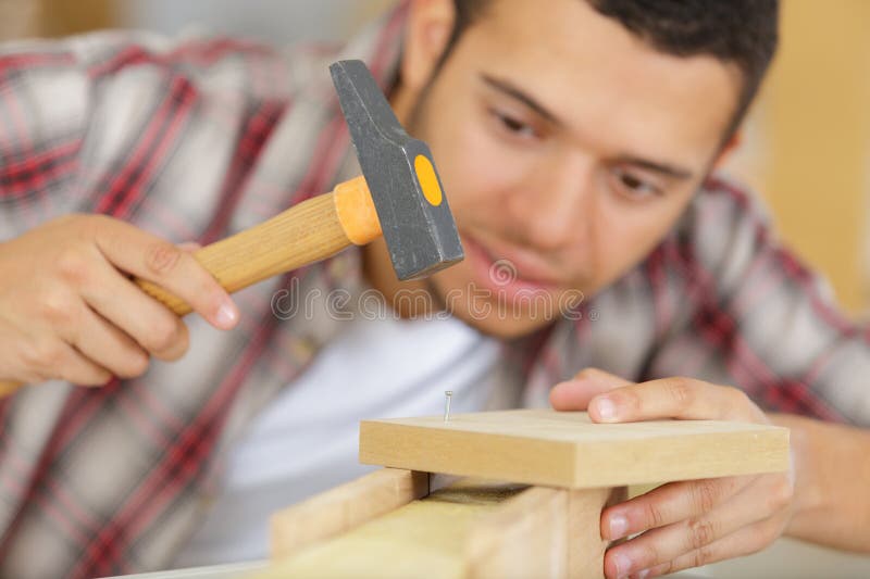 Carpenter Using Hammer on Wood Stock Image - Image of person, craft ...