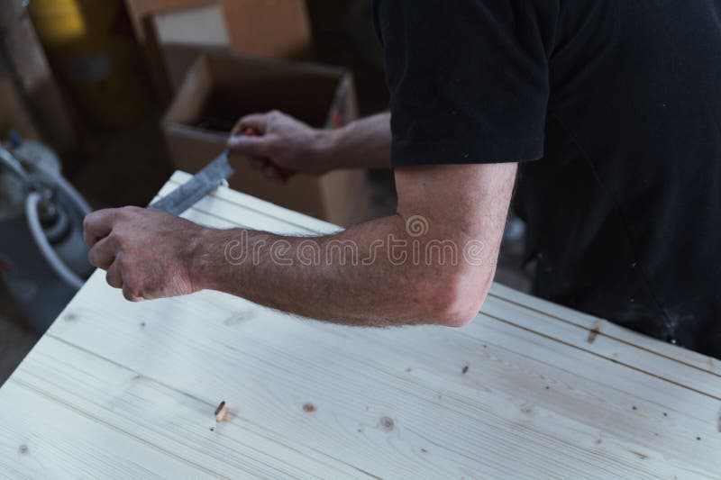 Carpenter Using Hand Plane on Wood Plank in Workshop Stock Photo ...