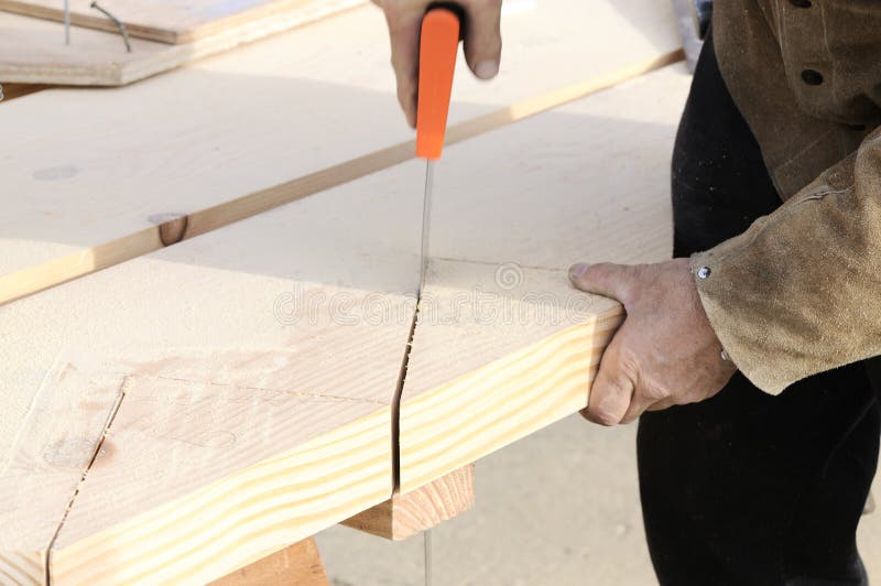 Carpenter using hand saw stock image. Image of labor, safety - 3909973