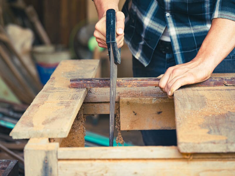The Carpenter Using a Hand Saw for Woodworking Stock Image - Image of ...
