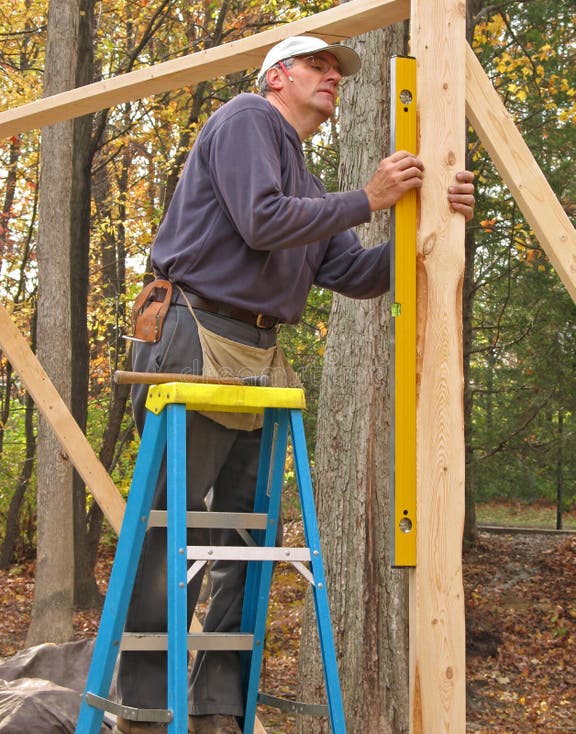Carpenter using a level stock photo. Image of level, carpenter - 7014318