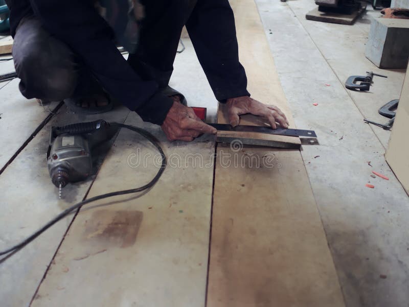 Carpenter Using Measure Tools in Carpentry Workshop. Stock Photo ...