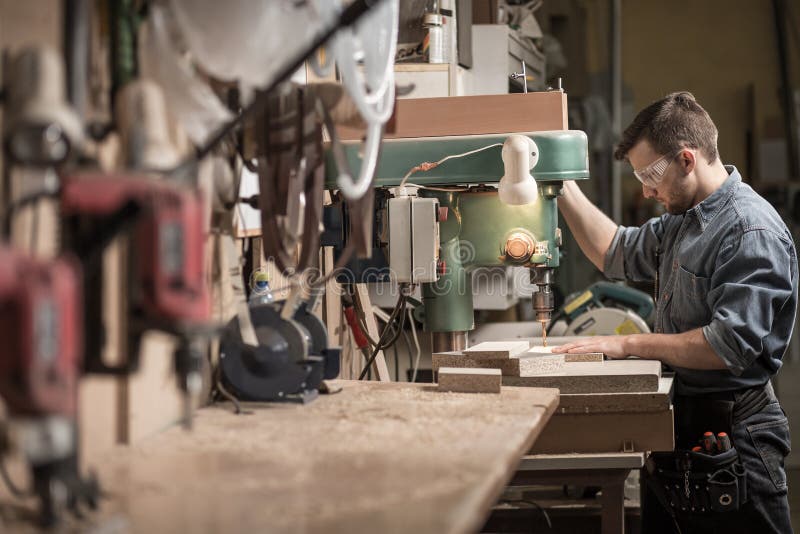 Carpenter Using Electric Saw Stock Photo - Image of protection, sawing ...