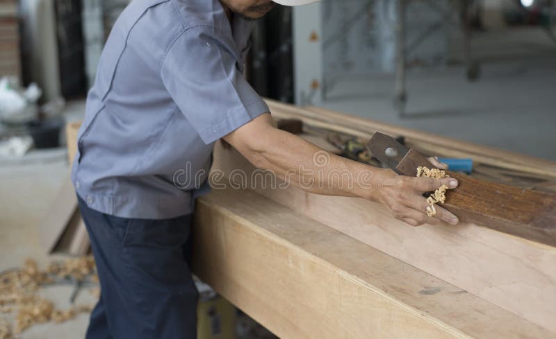 Carpenter Using Plane Tool. Stock Photo - Image of industry, furniture ...
