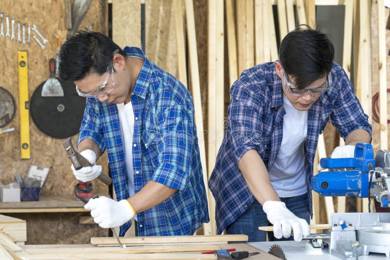 Carpenter Using Planning Machine at Carpentry Shop. Wood Processing ...