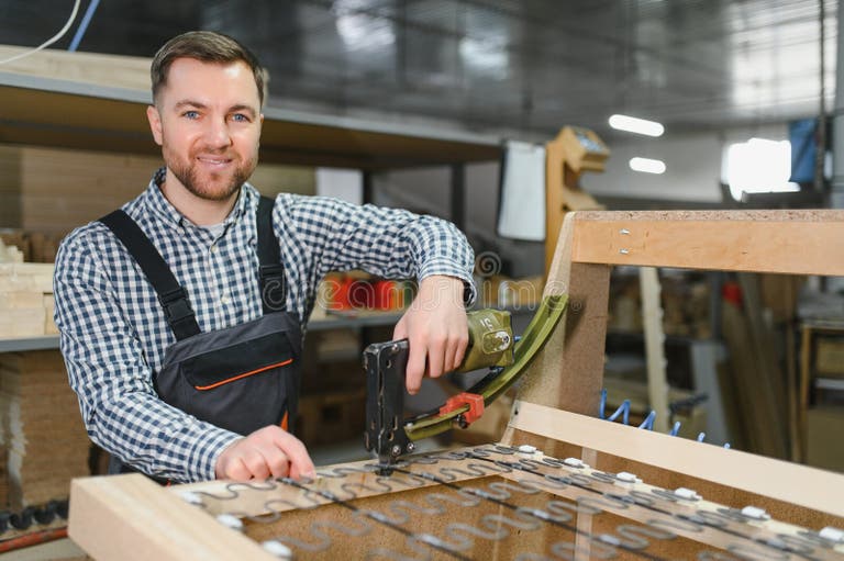 Carpenter Using Pneumatic Stapler Assembling Sofa Frame in Furniture ...