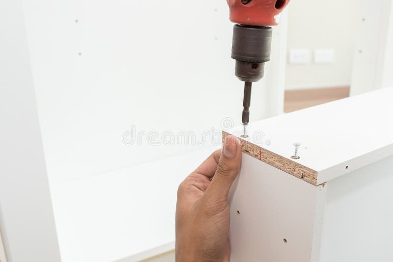 Carpenter Using Screwdriver Assemble Furniture Stock Photo - Image of ...