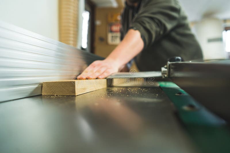 Carpenter Cutting Wood by Using a Table Saw in His Studio Handicraft ...