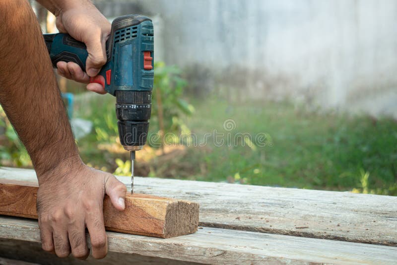 An Electric Drill that is Drilling Wood. Stock Image - Image of brush ...