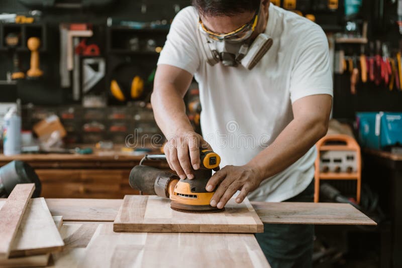Carpenter Wearing Protective Equipment Mask and Glasses Using a Random ...