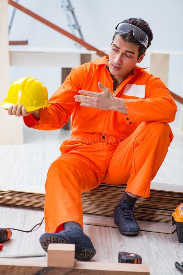 The Carpenter Wearing Yellow Hardhat in Contractor Workshop Stock Image ...
