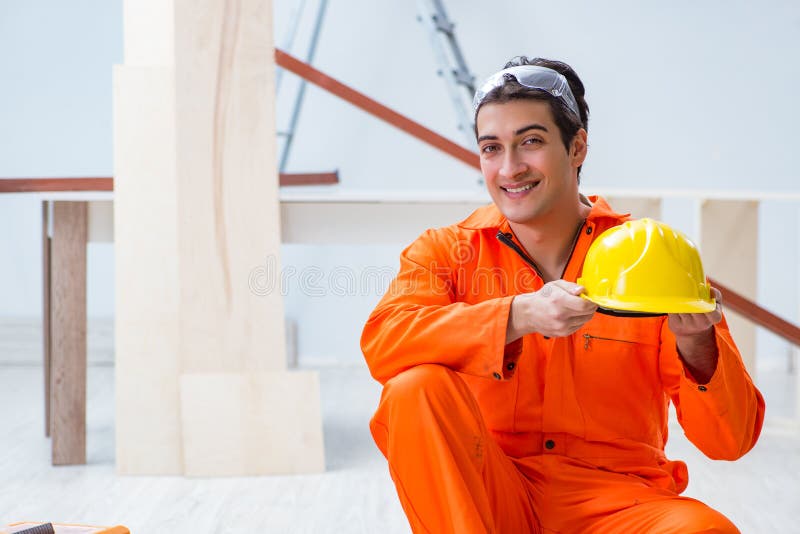 The Carpenter Wearing Yellow Hardhat in Contractor Workshop Stock Image ...