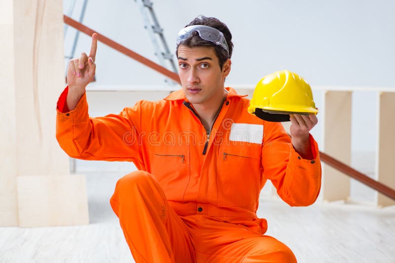 The Carpenter Wearing Yellow Hardhat in Contractor Workshop Stock Image ...
