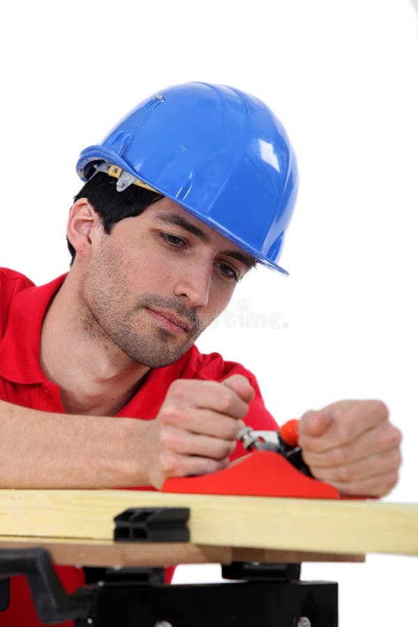 Carpenter with wood plane stock image. Image of surface - 29642639