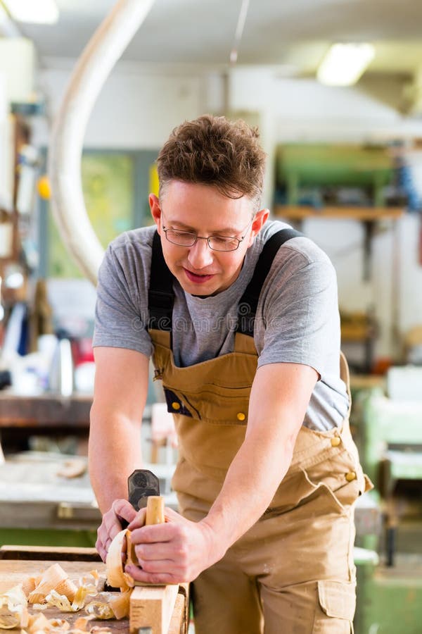 Carpenter with Wood Planer and Workpiece in Carpentry Stock Image ...