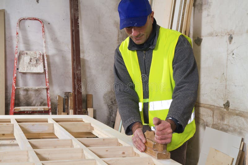 Carpenter at work stock image. Image of texture, sawing - 93873605
