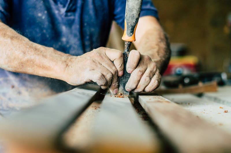 Professional Carpenter at Work, he is Carving Wood Using a Woodworking ...
