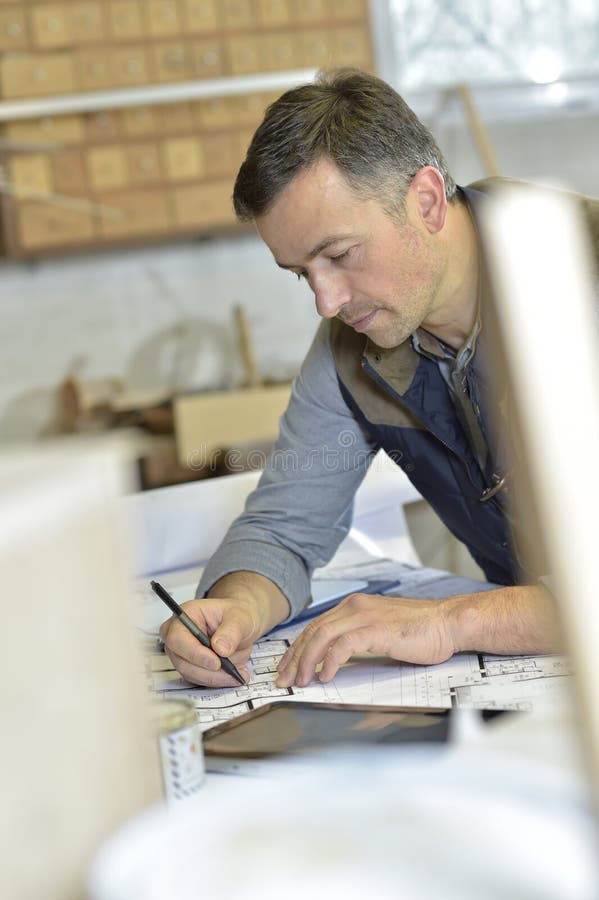 Carpenter at Work Designing Plans Stock Photo - Image of people ...
