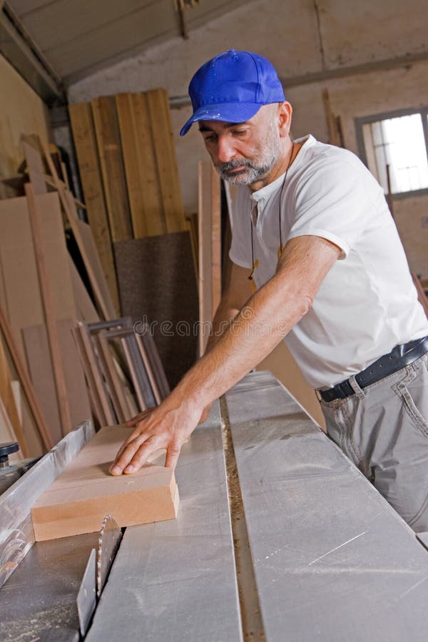 Carpenter at work stock image. Image of hands, wood, sawing - 93873983