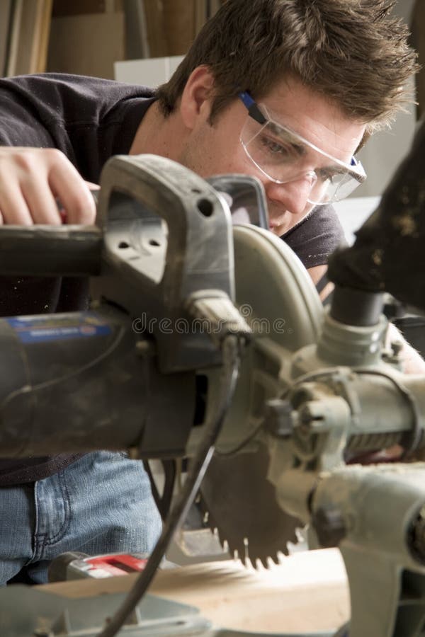 Carpenter at Work on Job Using Power Tool Stock Photo - Image of ...