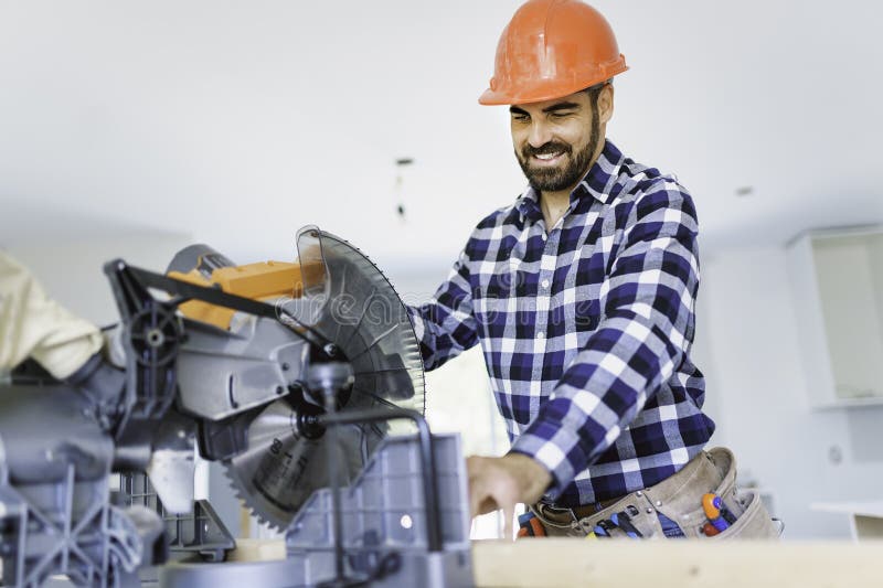 Carpenter at Work on Job Using Power Tool Stock Photo - Image of ...