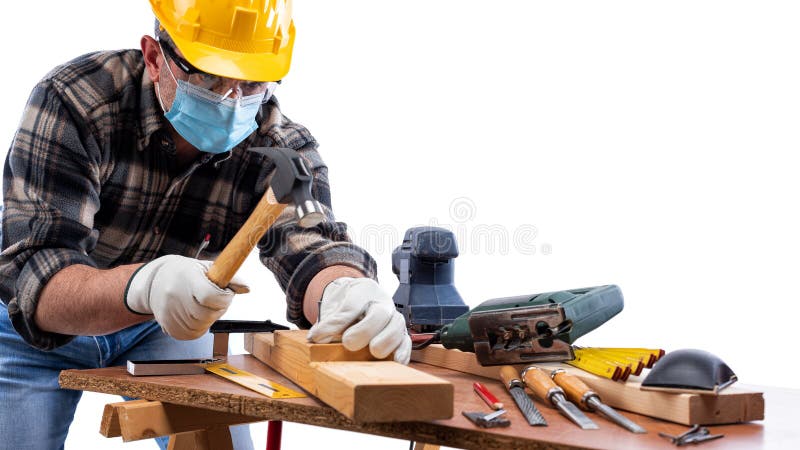 Carpenter at Work Protects the Face with the Surgical Mask. Carpentry ...