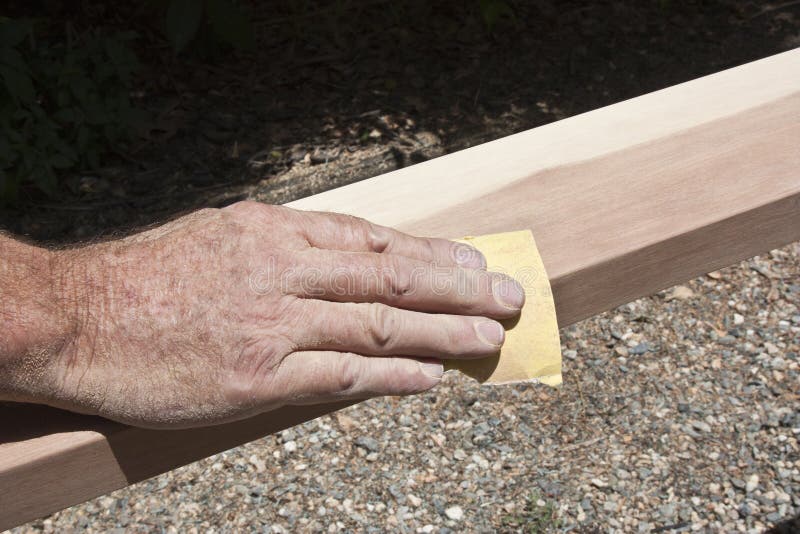 Carpenter at Work, Sanding a Piece of Timber Stock Photo - Image of ...