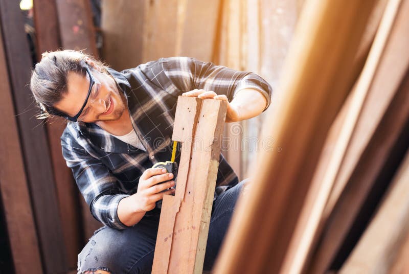 Carpenter Work in Wood Workshop Selecting Timber for His Woddwork Stock ...