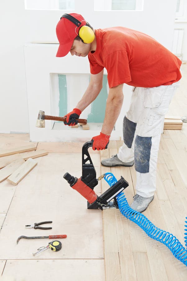 Parquet Worker Adding Glue on Floor Stock Photo - Image of flooring ...