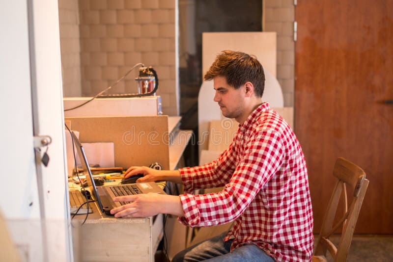 Carpenter Worker Prepares a Computer Program Software for CNC Ma Stock ...