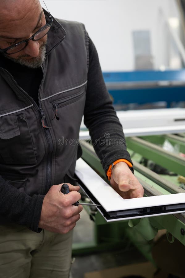 Carpenter Working on Aluminum Window Frame in Workshop Stock Image ...