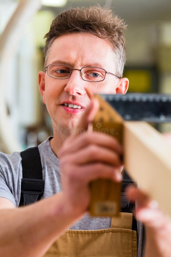 Carpenter with Angle and Pencil Stock Image - Image of hands, male ...