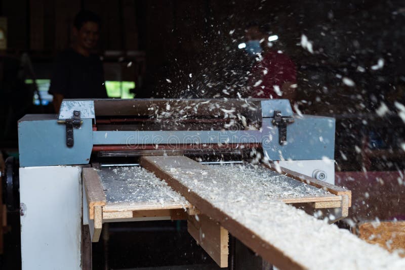 Automated Sanding Machine for Wood Boards. Wood Dusts Scattered ...