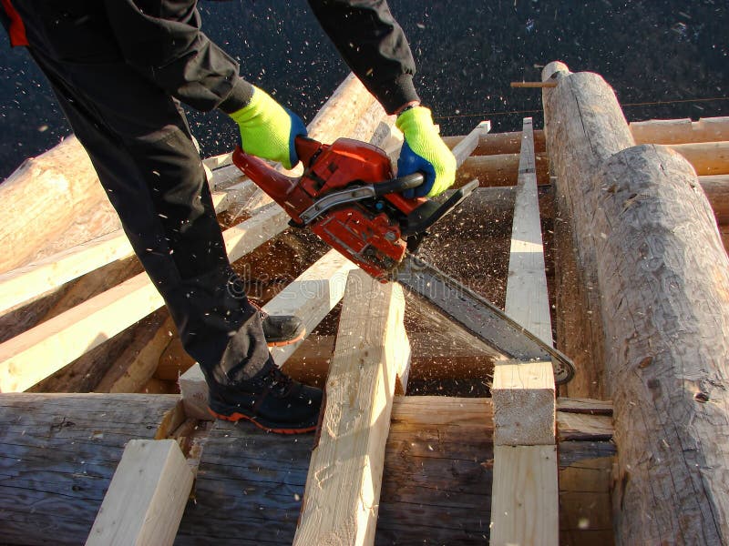 Carpenter working at cabin stock photo. Image of reconstruction - 111991822