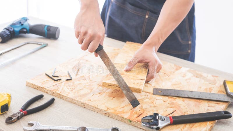 Carpenter Working Carefully Looking at the Plans Work in Carpentry. he ...