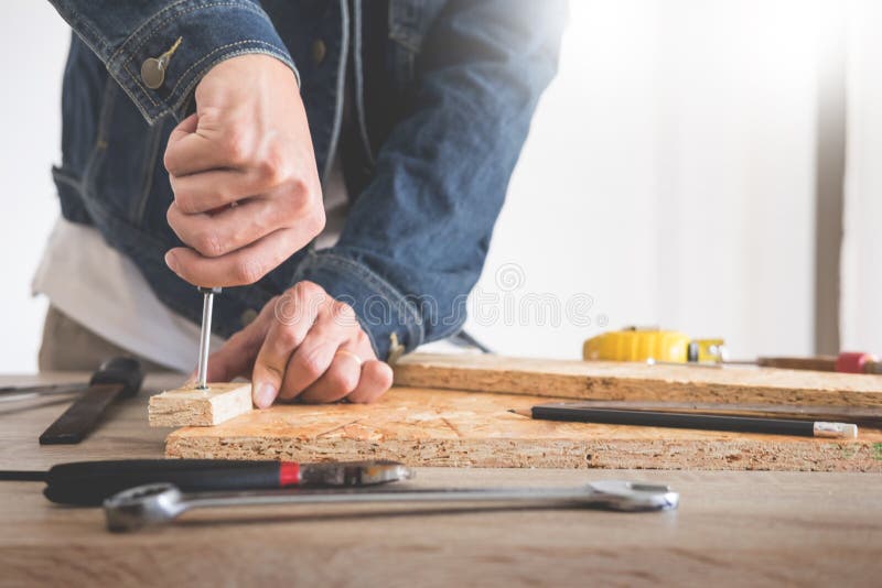 Carpenter Working Carefully Looking at the Plans Work in Carpentry. he ...